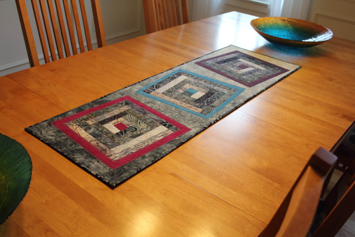 Fused log cabin table runner - WeAllSew