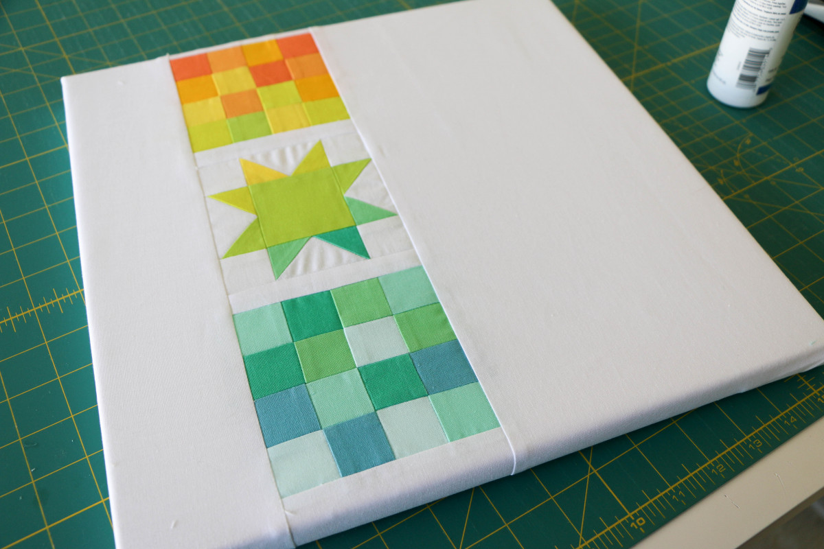 How to Wrap Fabric on a Frame - WeAllSew