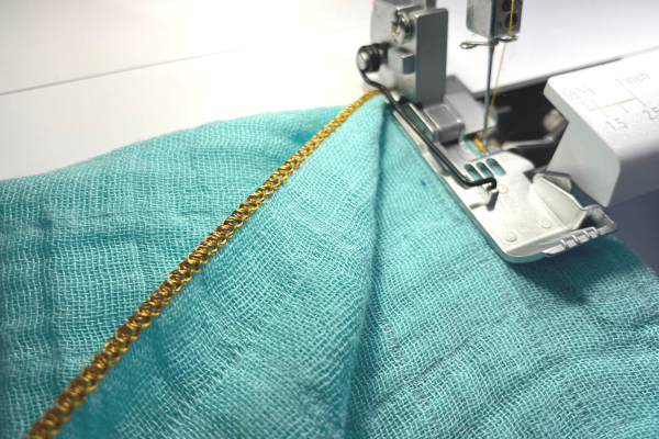 Serger Tablecloth with Decorative Flatlock and Rolled Hem - WeAllSew