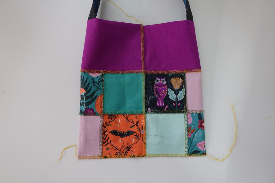 Flatlock Patchwork Trick-or-Treat Bag - flatlock bottom seam of flatlock patchwork bag - WeAllSew
