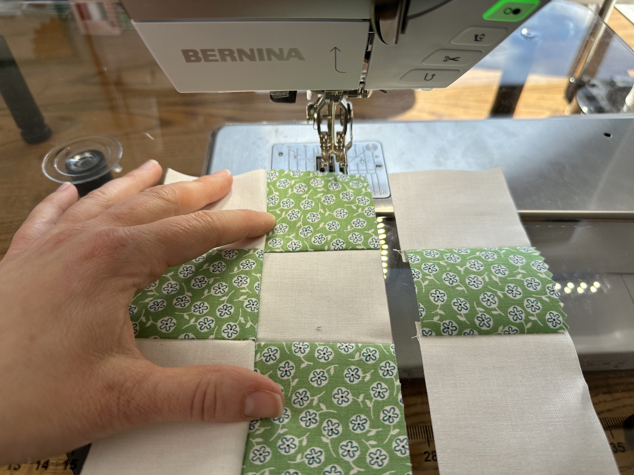 Assembling the rows of a Nine Patch for the Nona Quilt Along BERNINA WeAllSew blog - WeAllSew