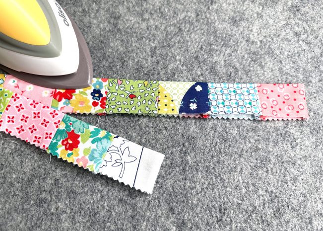 Press-neck-ruffle-in-half-lengthwise - WeAllSew