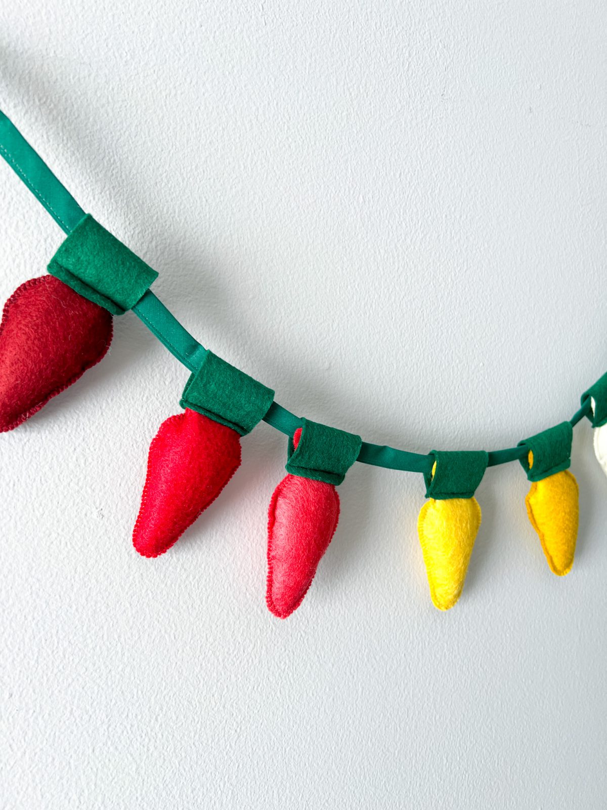 Felt Bulb Garland Tutorial - finished classic color garland - WeAllSew