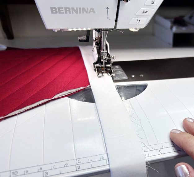 sewing towards a corner on white binding - WeAllSew